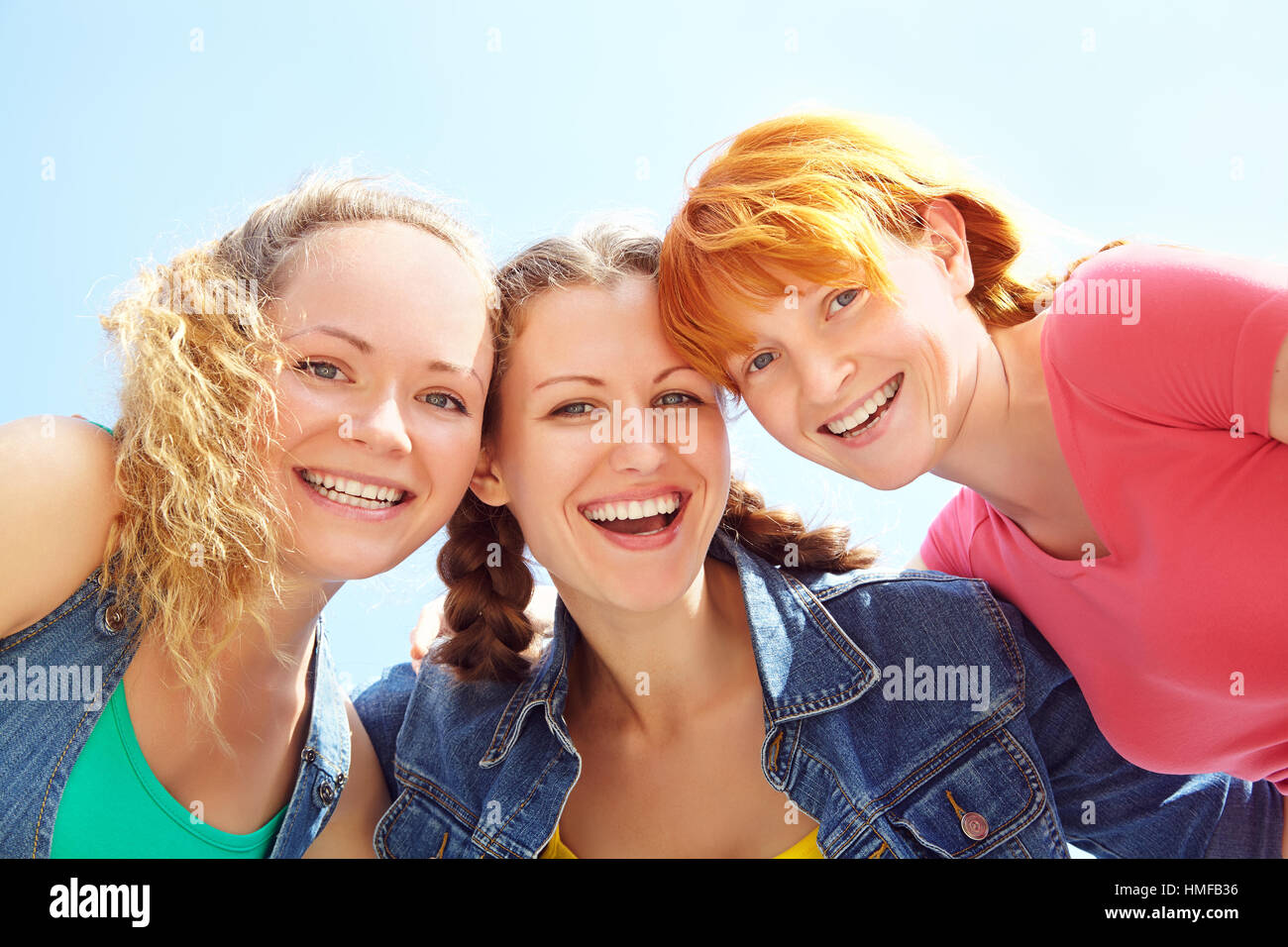 Three happy girls Stock Photo - Alamy