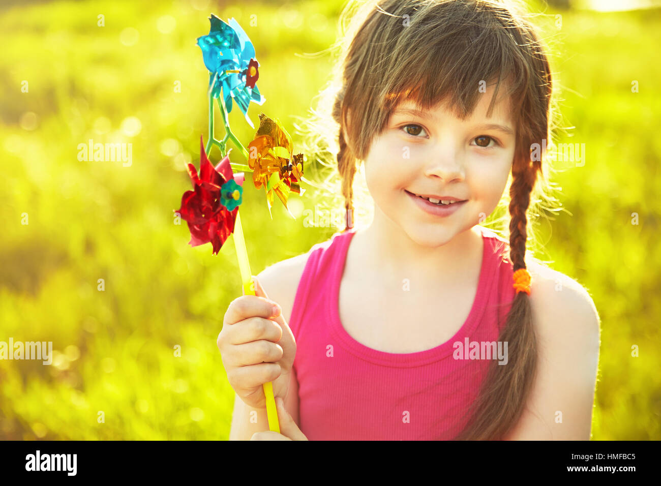 girl with pinwheel Stock Photo - Alamy