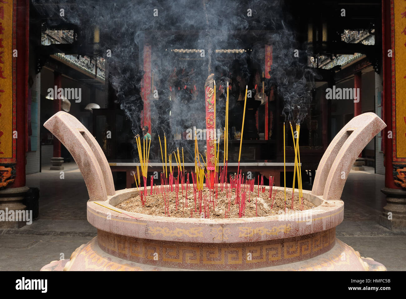 Burning prayer sticks at the Chinese temple in the centre Ha Noi ...