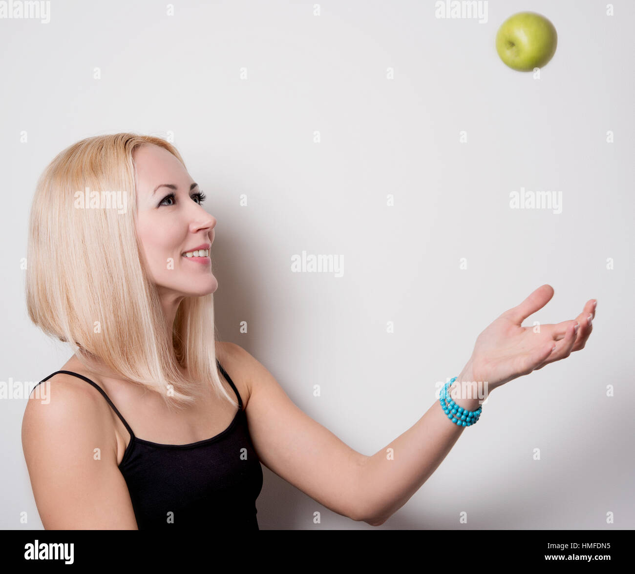girl throws Apple Stock Photo - Alamy