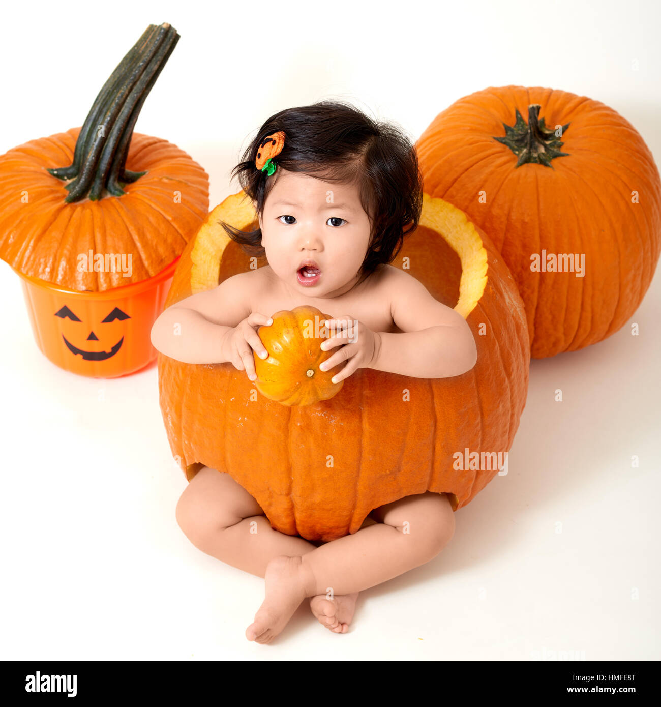 Child sitting giant pumpkin hi-res stock photography and images - Alamy