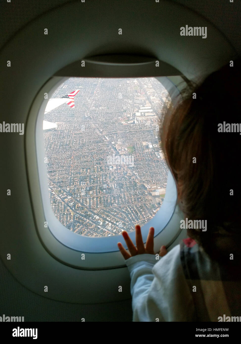 Curious baby on the plane looking out the window for the first time ...