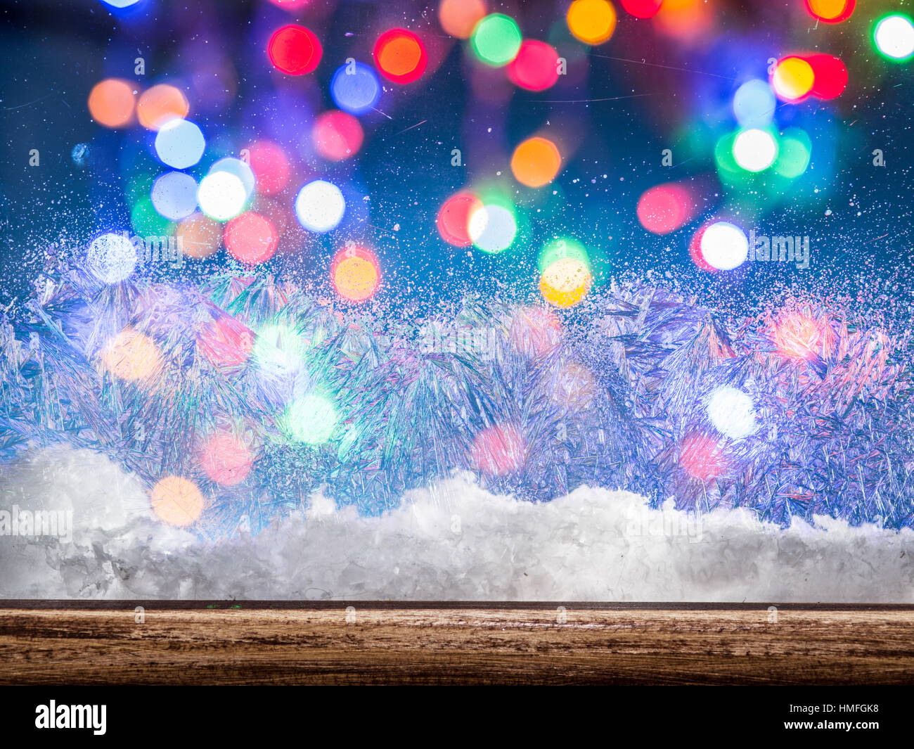 Frozen window with blurred colored lights on the background Stock Photo ...