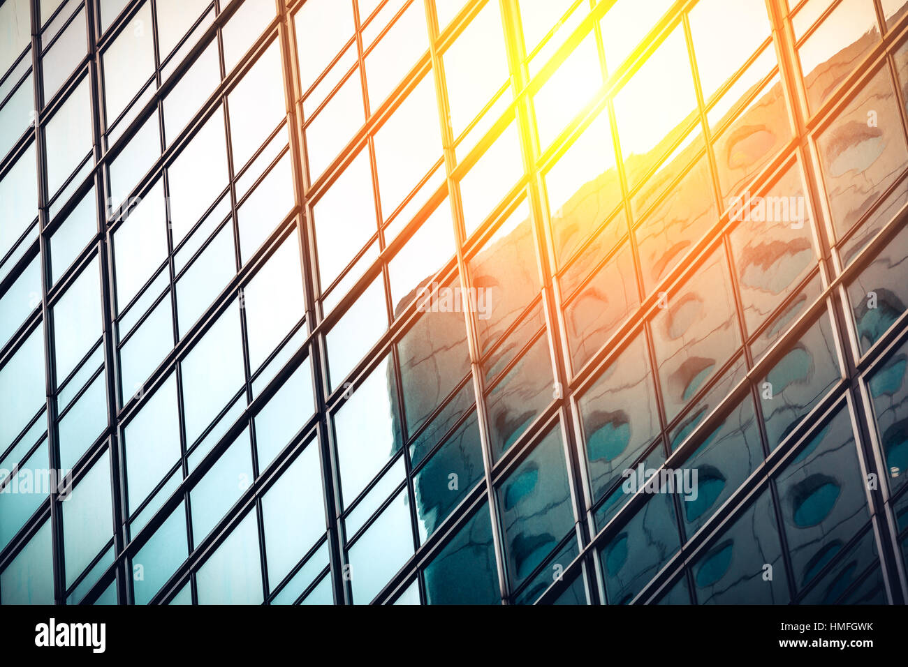 Modern office building with sun ray reflection from corner Stock Photo ...