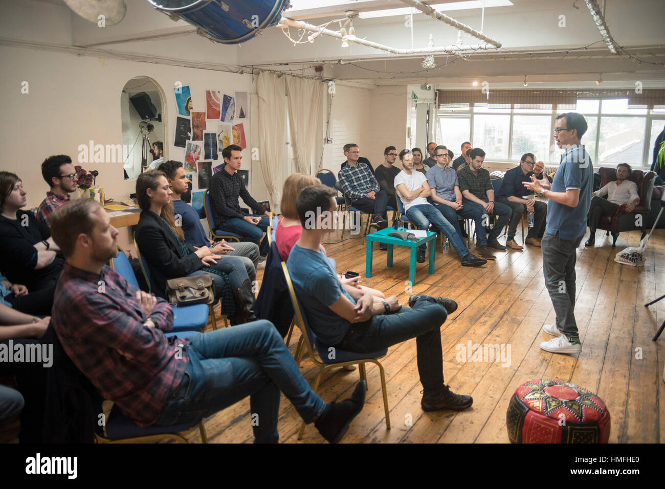 A creative advertising agency having a company meeting / lecture / talk ...