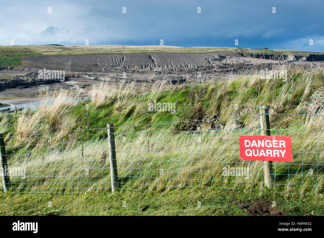 Danger Quarry Works warning sign on the edge of a disused quarry ...