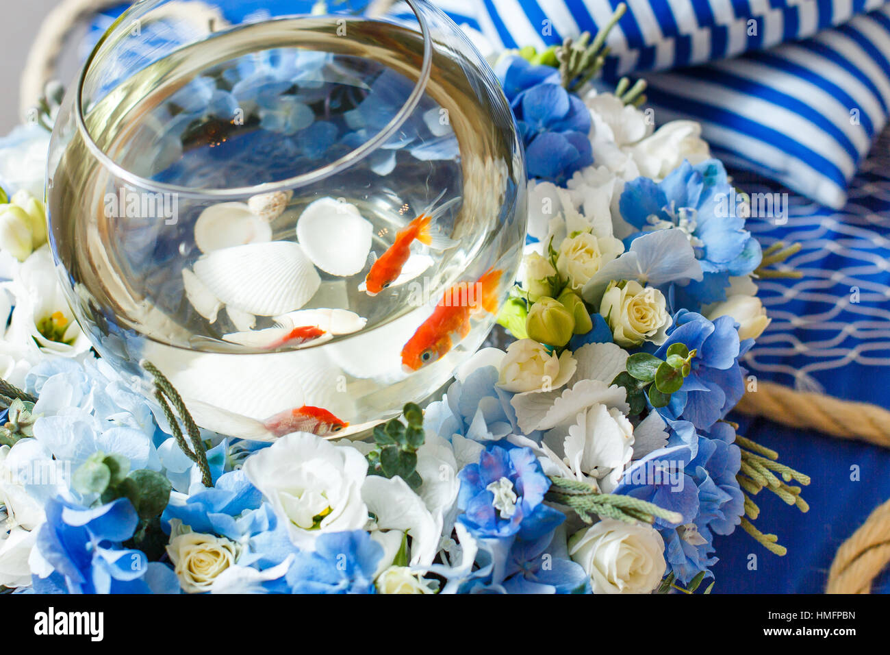 golden fish decoration flower arrangement Stock Photo - Alamy