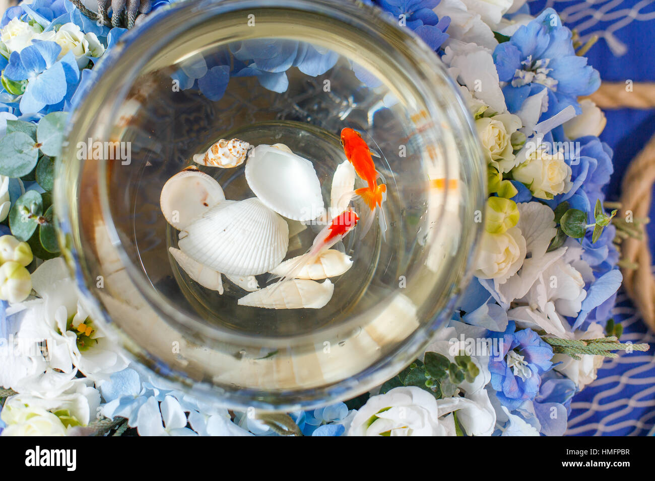 golden fish decoration flower arrangement Stock Photo - Alamy