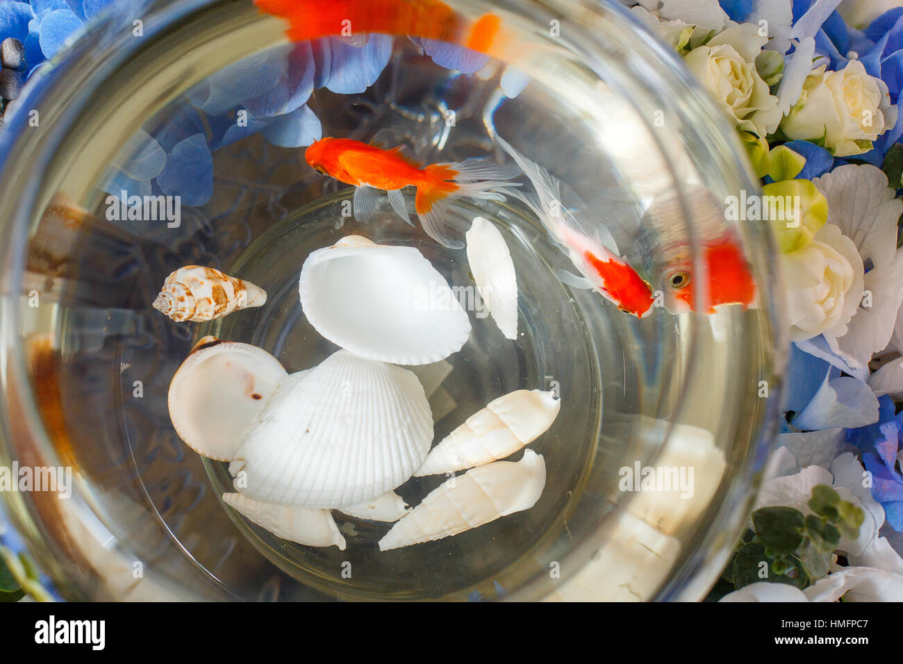 golden fish decoration flower arrangement Stock Photo - Alamy