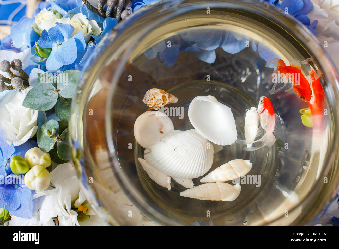 golden fish decoration flower arrangement Stock Photo - Alamy