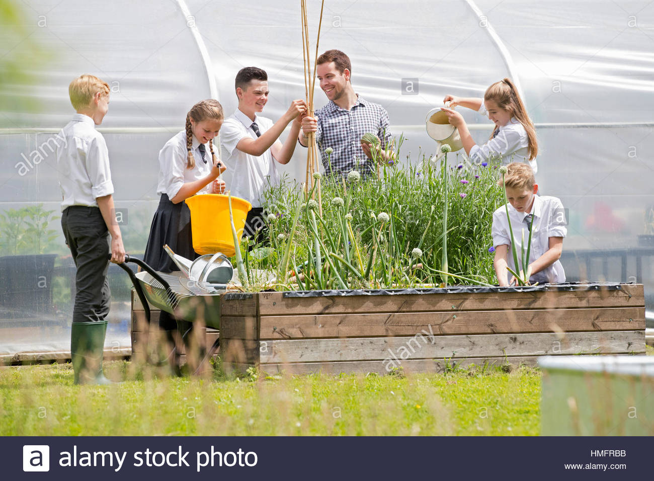 Teacher Students In School Uniforms Stock Photos & Teacher Students In ...