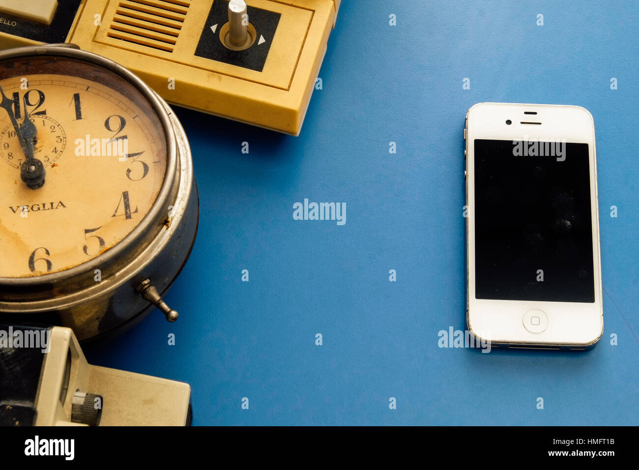 1980s technology gears have been replaced by modern smartphones for ...