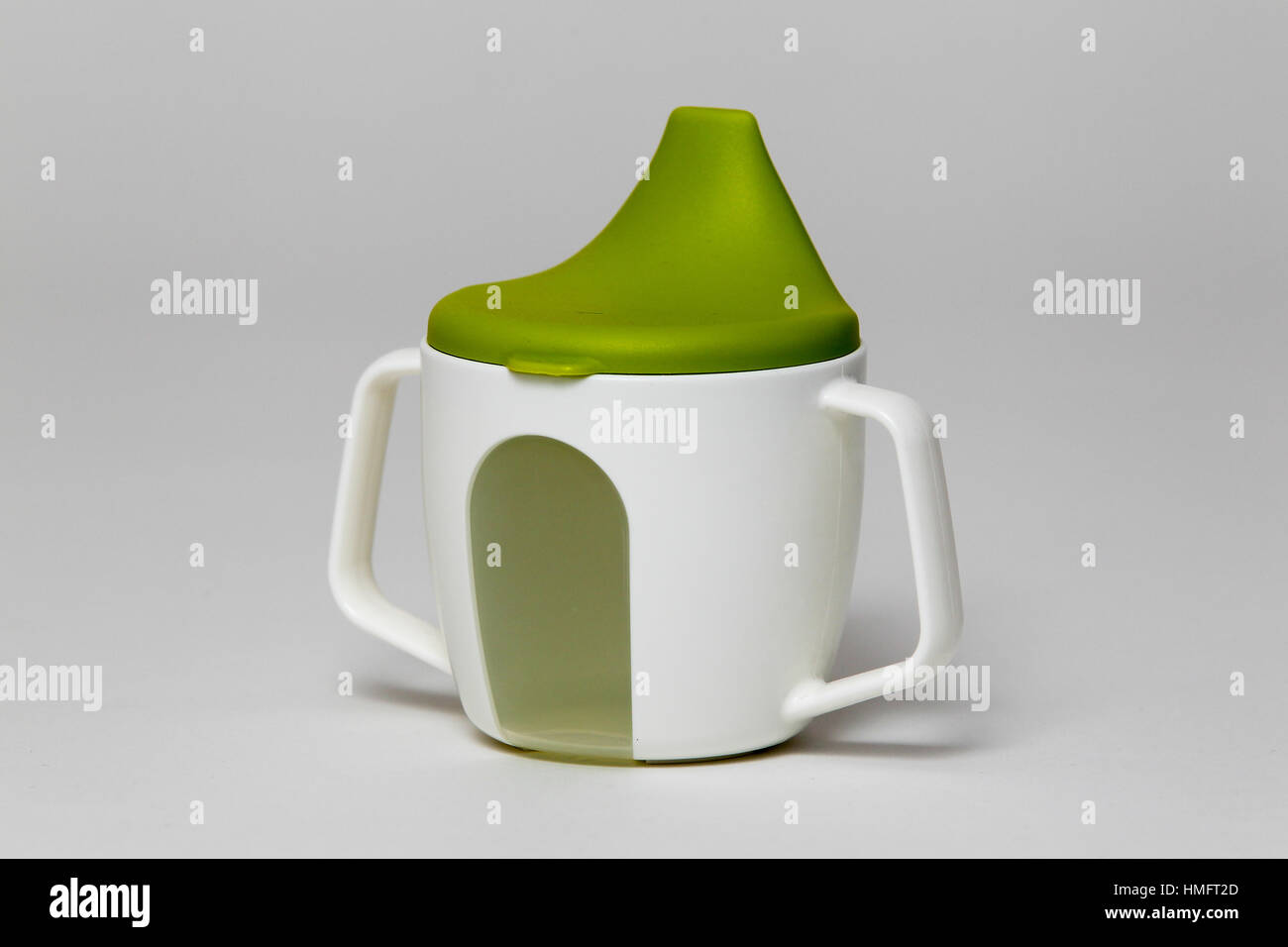 Toddler's plastic beaker against a white background Stock Photo - Alamy