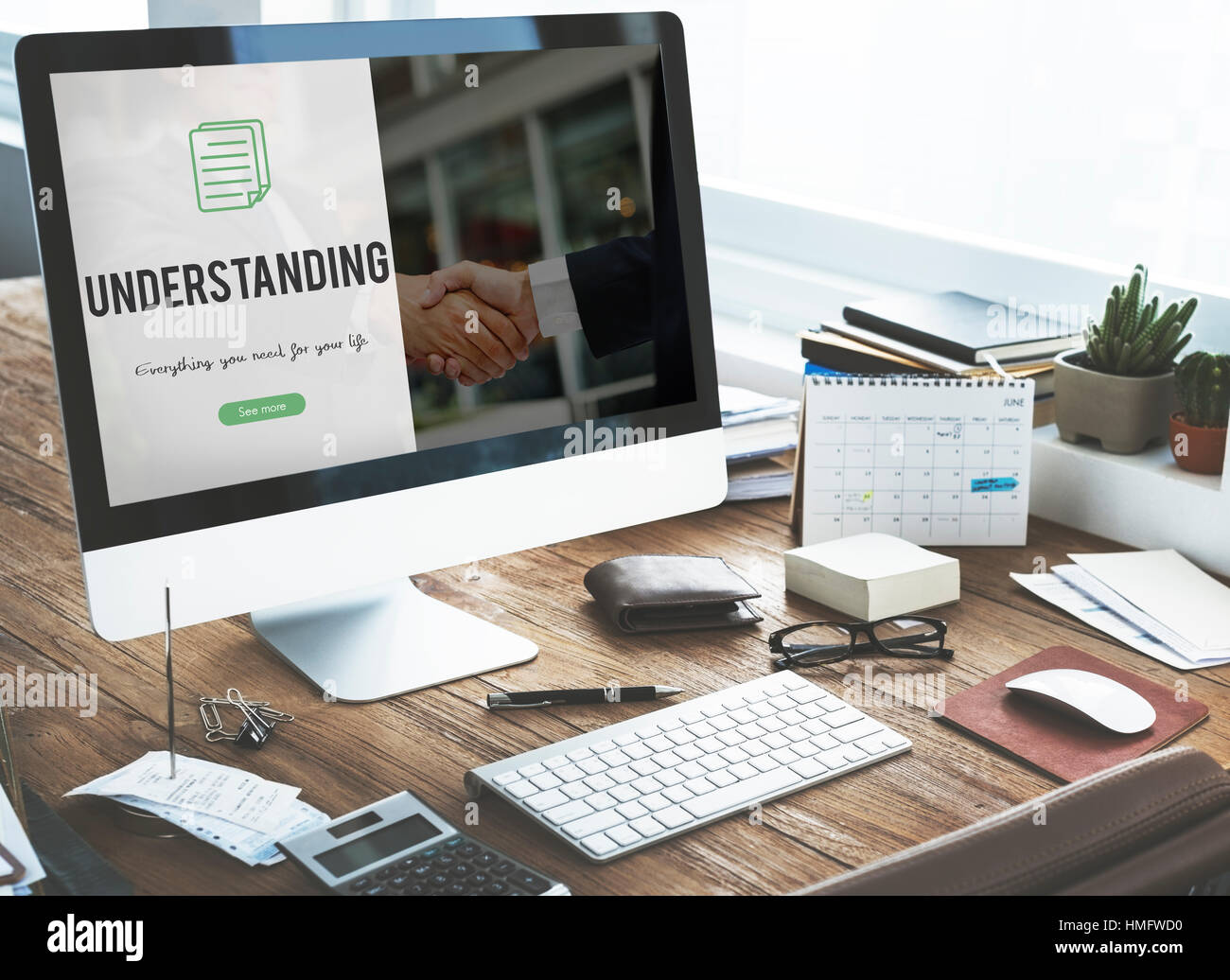 Understanding word on business handshake background Stock Photo - Alamy