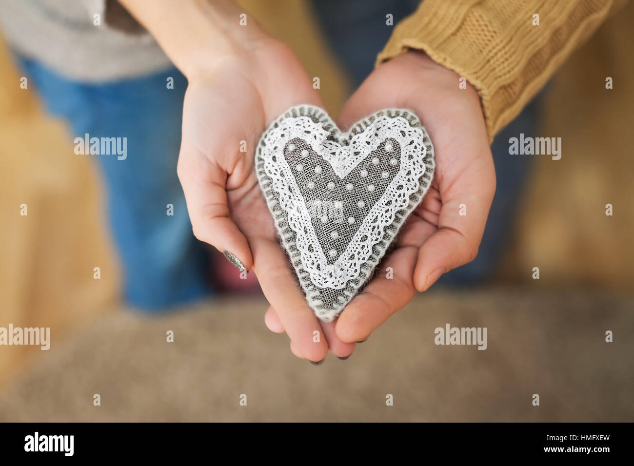 Lovers hands holding handmade hi-res stock photography and images - Alamy