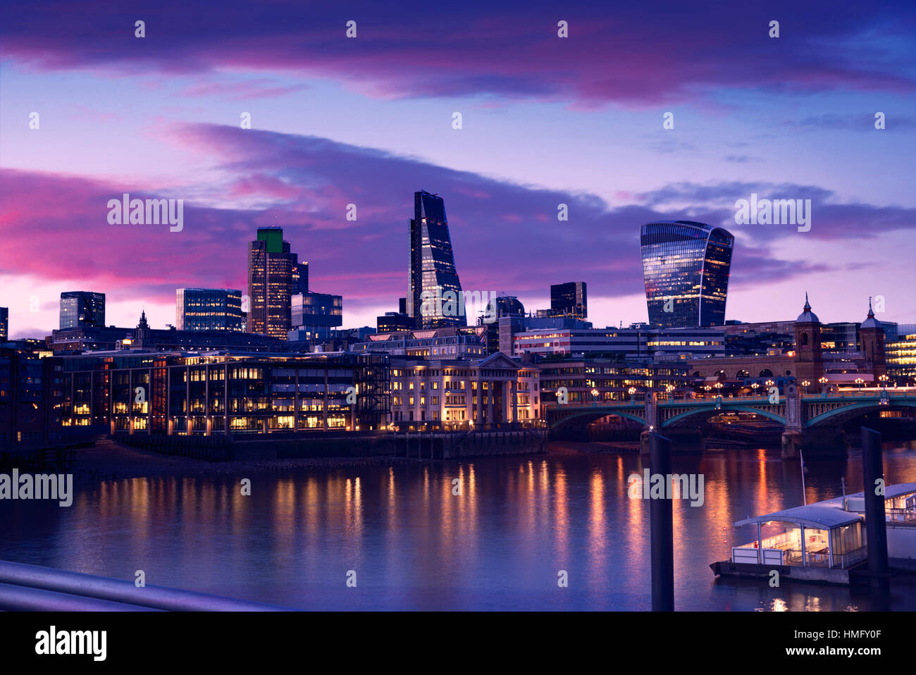 London skyline sunset on Thames river reflection at UK Stock Photo - Alamy