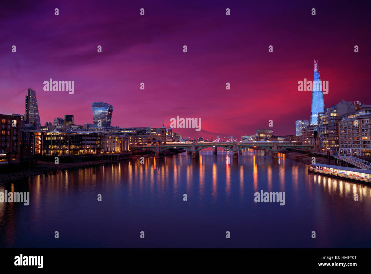 London skyline sunset on Thames river reflection at UK Stock Photo - Alamy