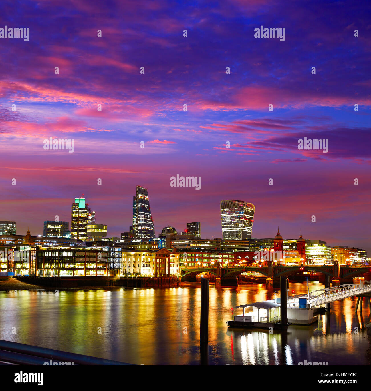London skyline sunset on Thames river reflection at UK Stock Photo - Alamy