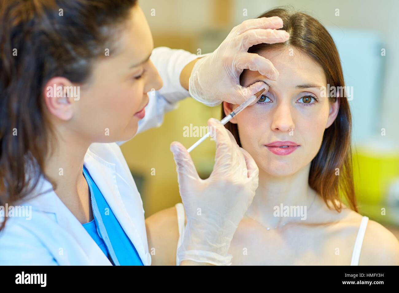 Syringe. Botox, cosmetic medicine. Botulinum toxin treatment involves ...