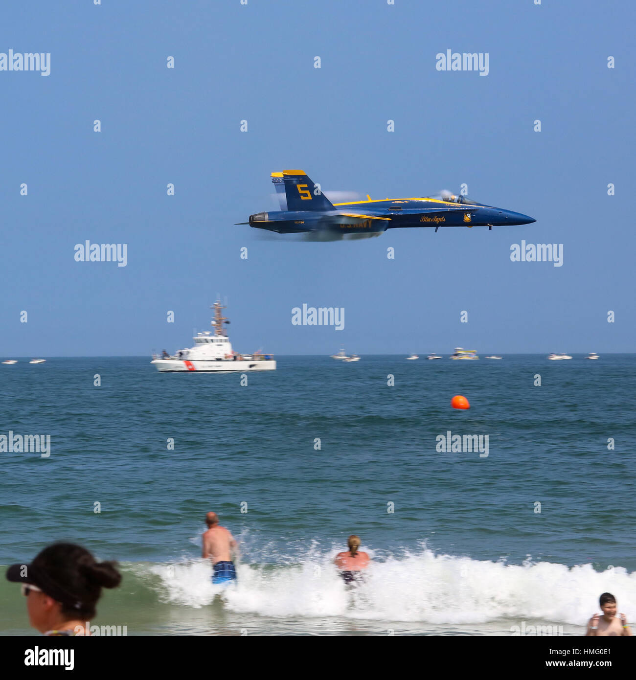 Navy Blue Angels solo aircraft in near super-sonic pass. Water ...