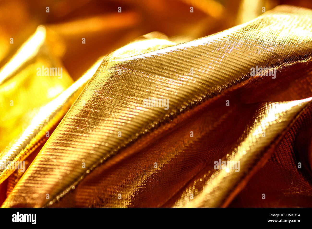 Gold woven material Stock Photo - Alamy