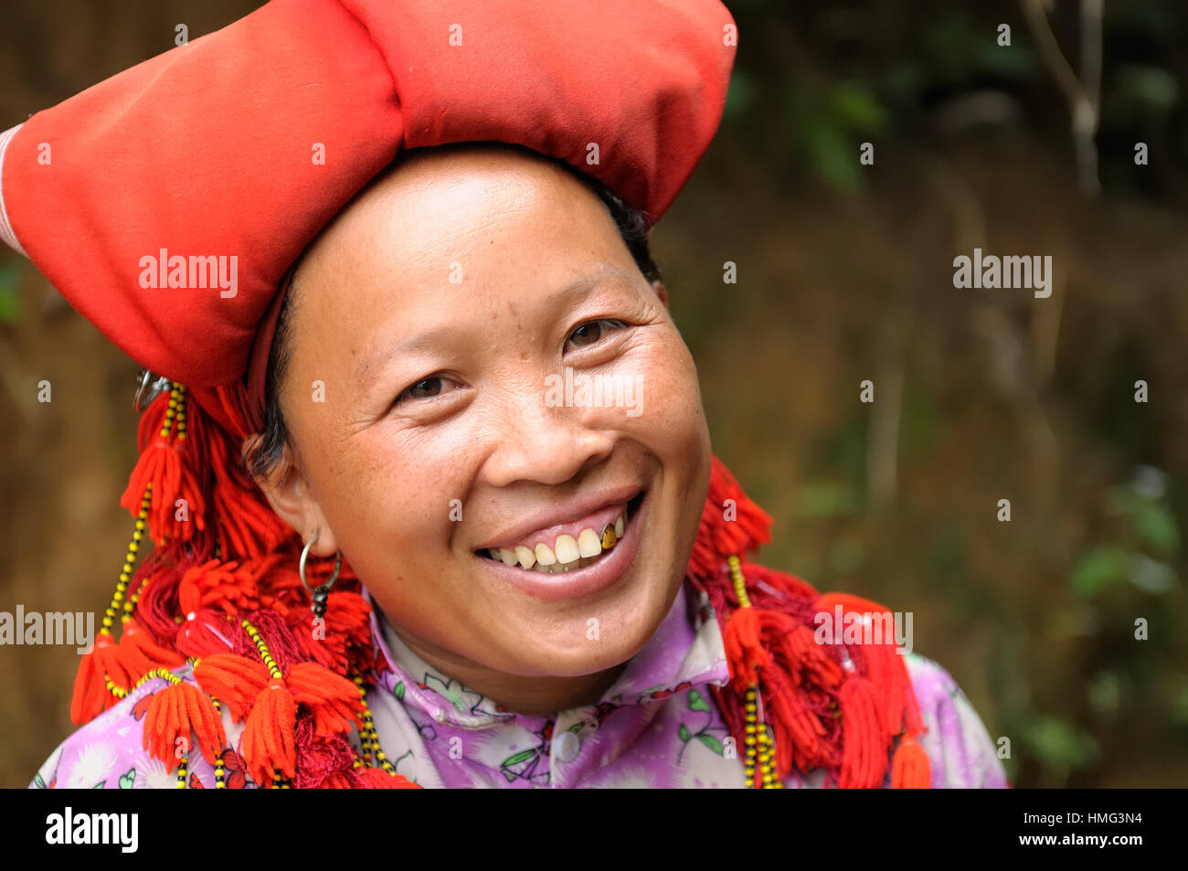 Sapa, Vietnam - October 24: Woman in the traditional dress of Red Dao ...