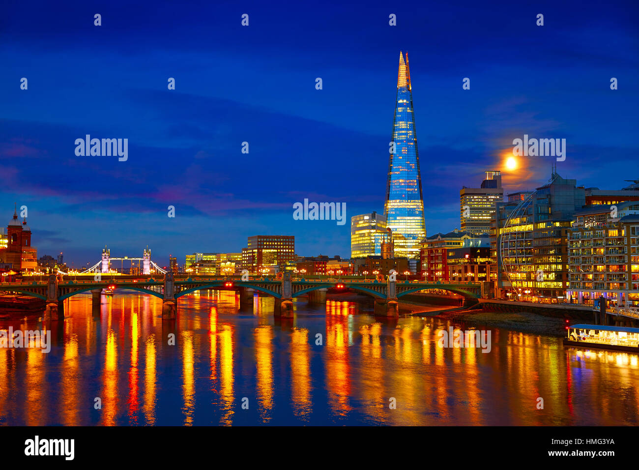 London skyline sunset on Thames river reflection at UK Stock Photo - Alamy