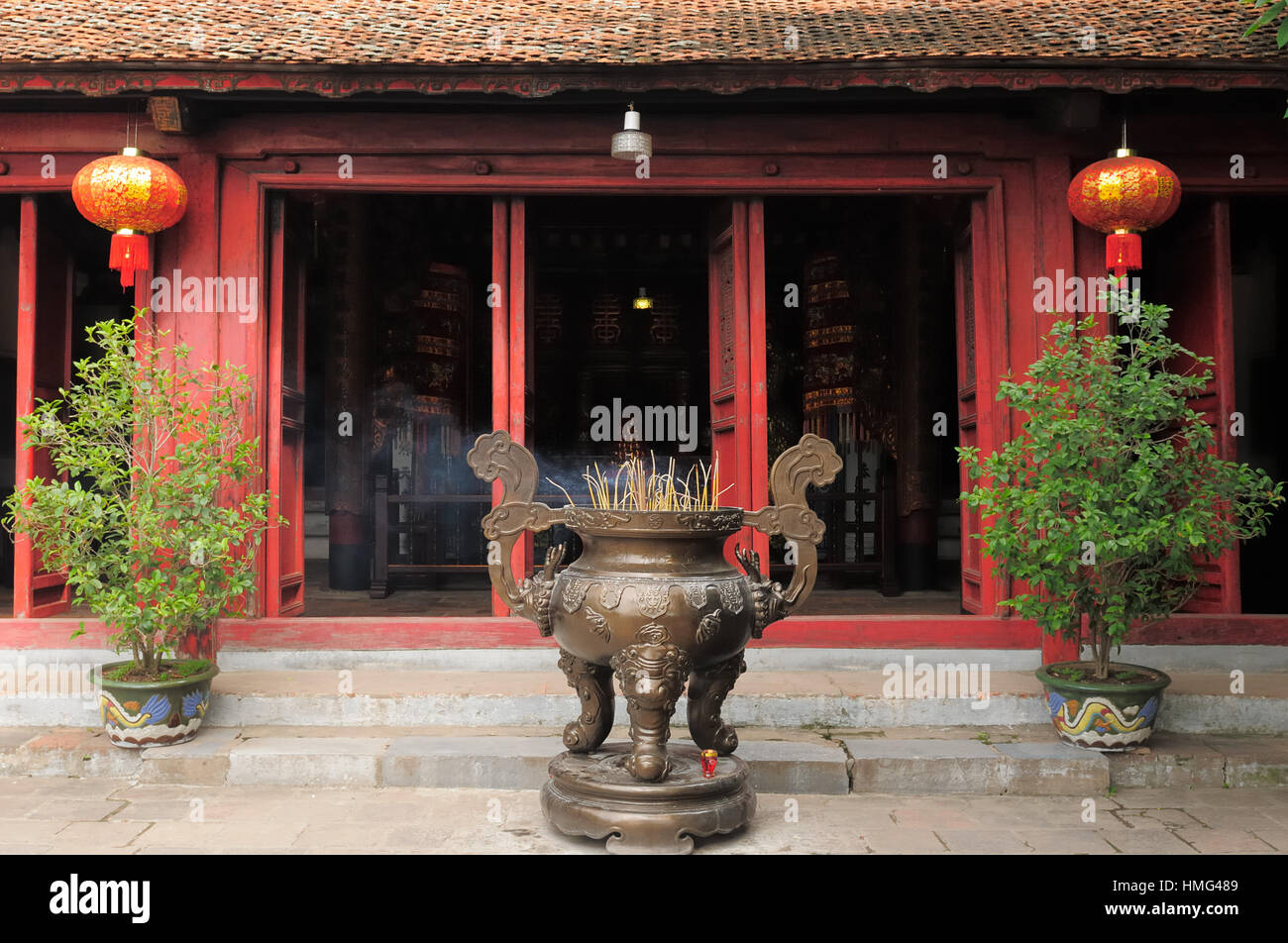 Burning prayer sticks at the Chinese temple in the centre Ha Noi ...