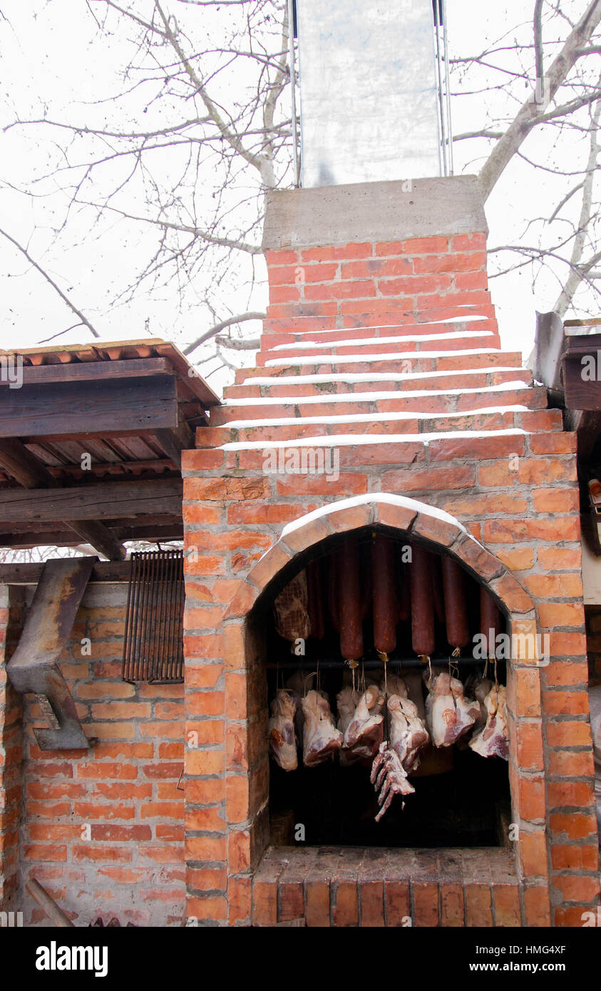 Smoking meat, sausage, bacon and other products in the traditional way ...