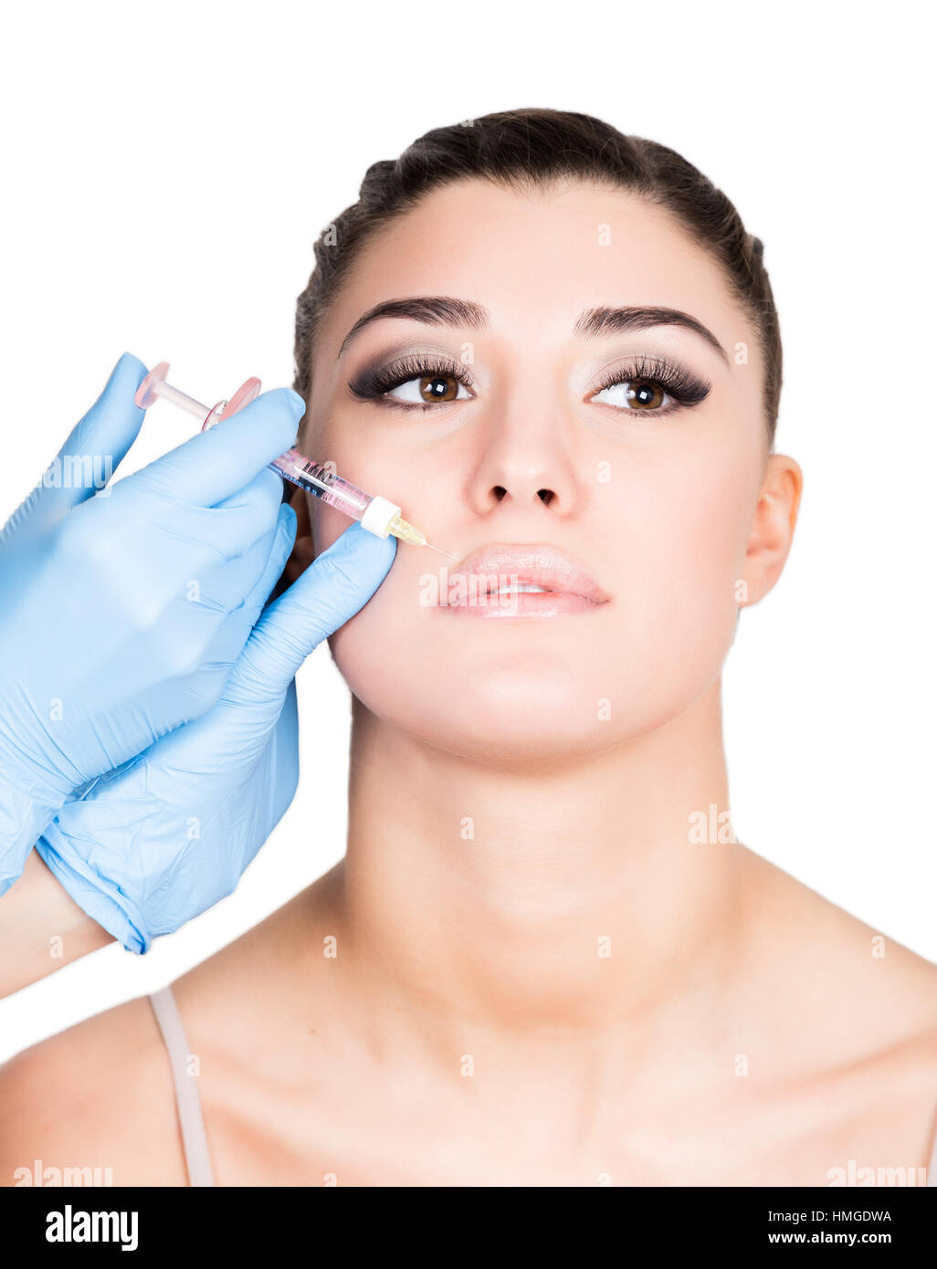 beautiful young woman face and syringe making injection. Isolated over ...