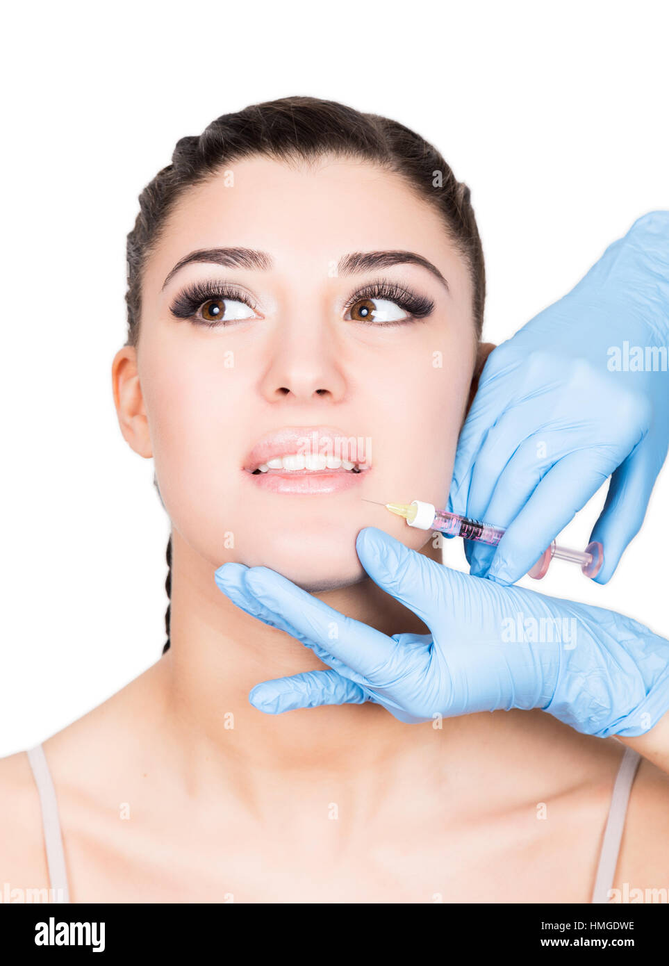 beautiful young woman face and syringe making injection. Isolated over ...