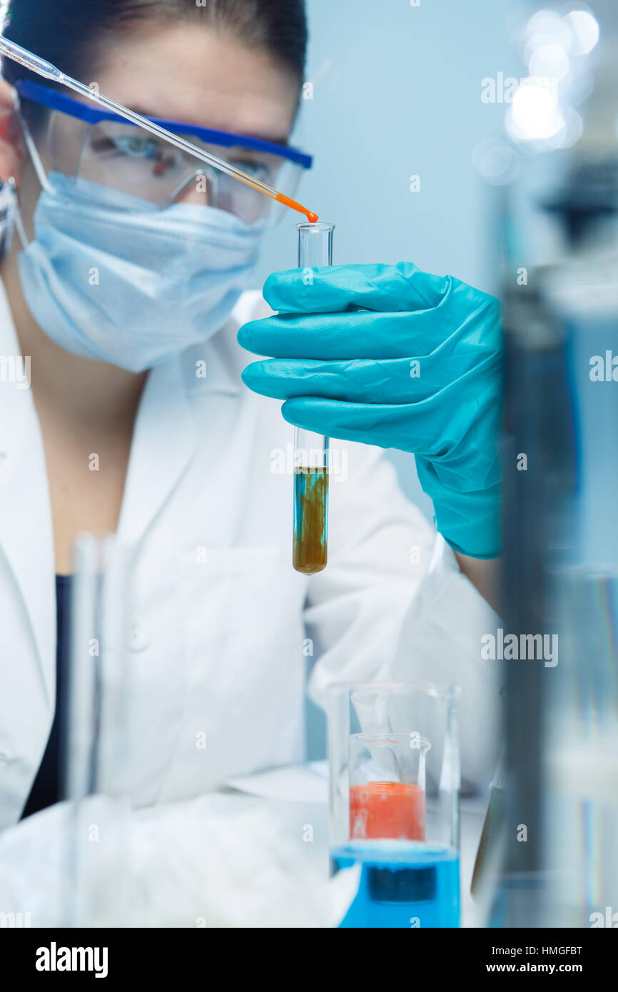 Young technician with chemical substances in laboratory Stock Photo - Alamy