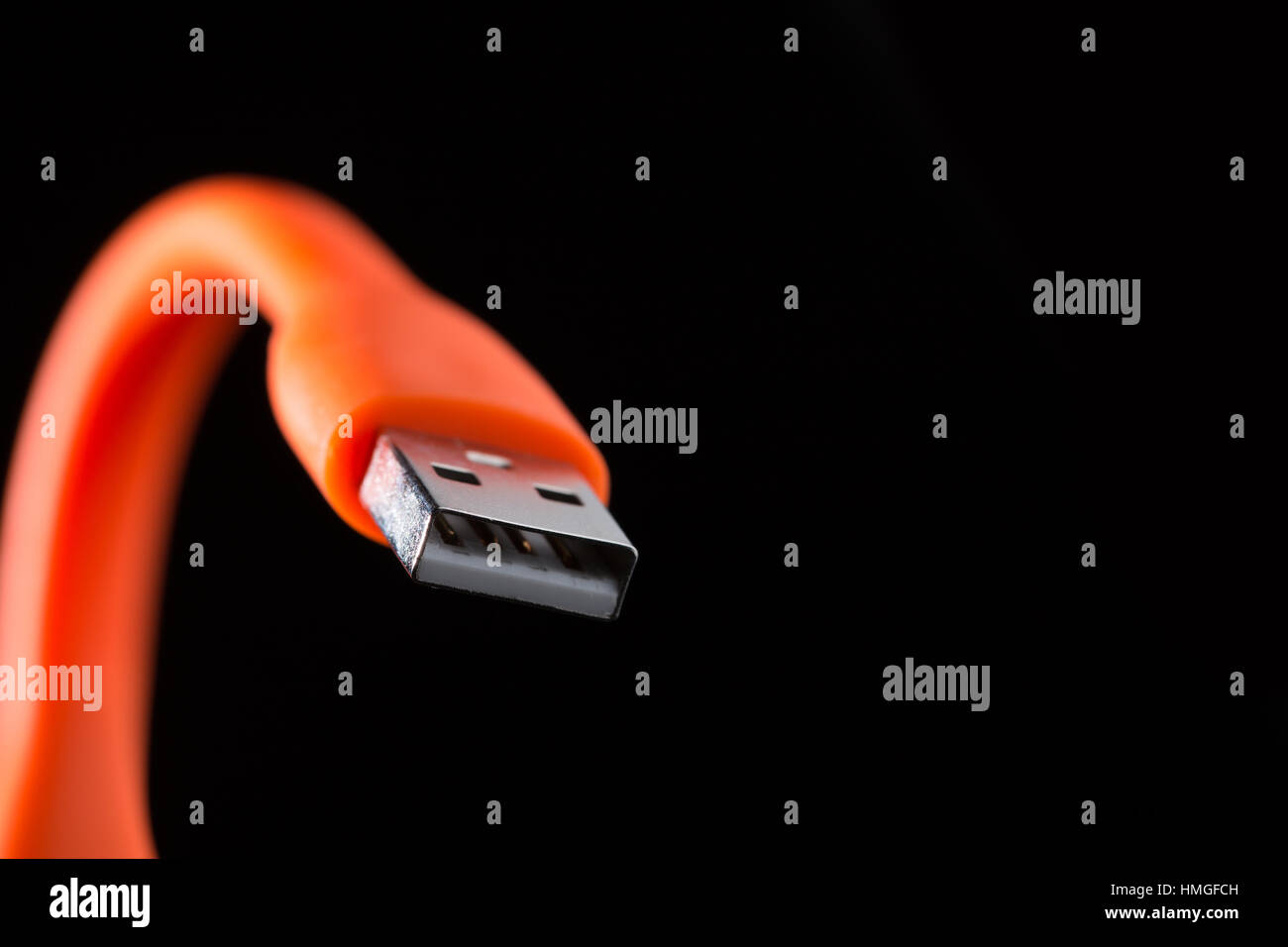 Connecting computer cable on black empty background Stock Photo - Alamy