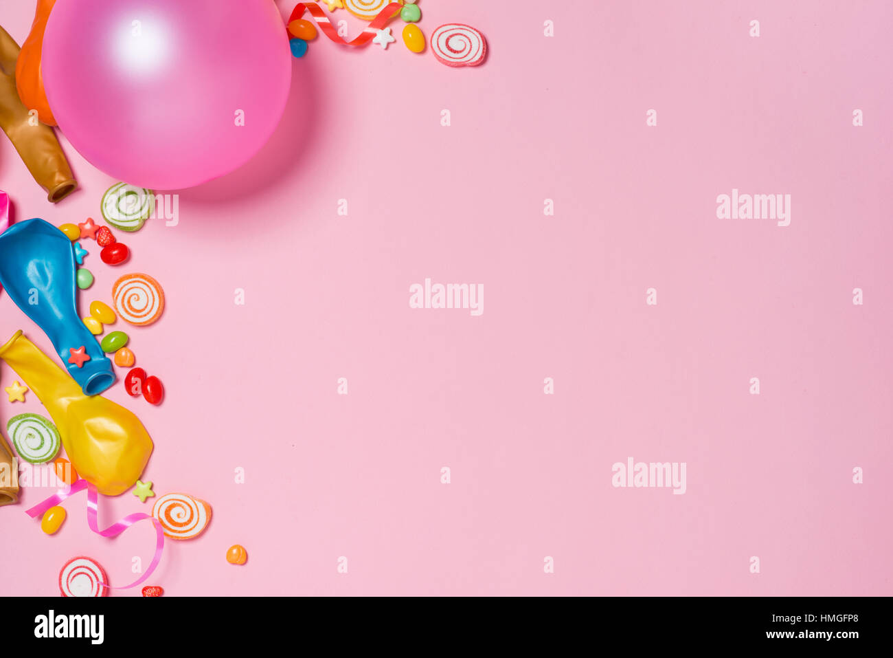 Celebration Flat lay. Candy with colorful party items on pink ...