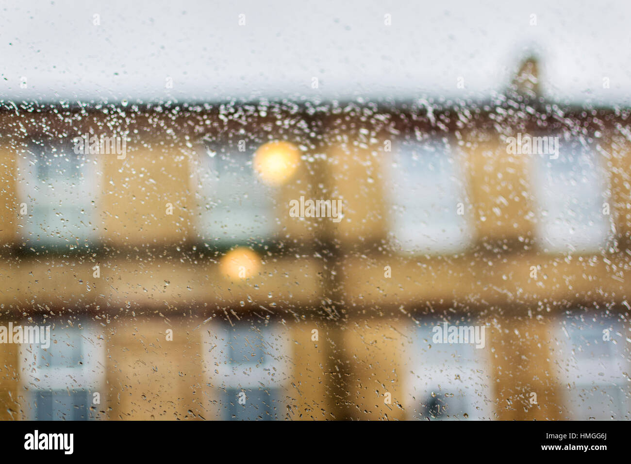 Raining outside - raindrops hitting window glass Stock Photo - Alamy