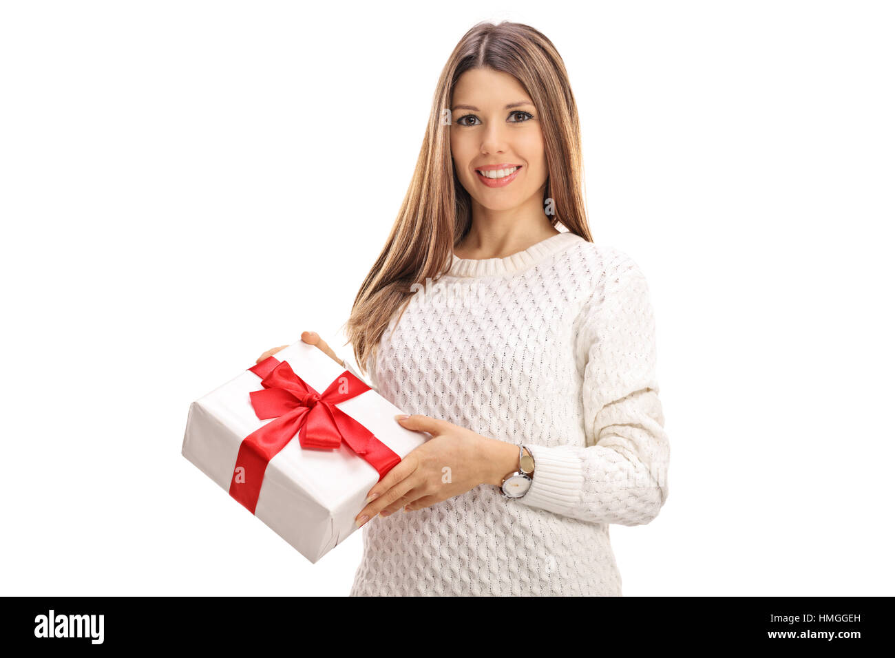 Joyful young woman with a present isolated on white background Stock ...