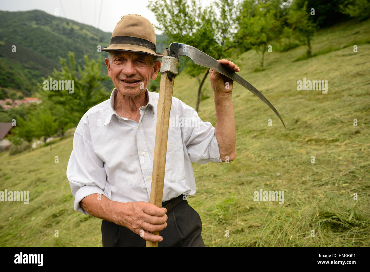 The farmer at work in a garden, Romania Stock Photo - Alamy