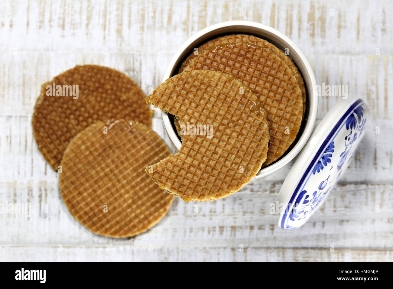 traditional Dutch syrup waffles in an original Delftware container on ...