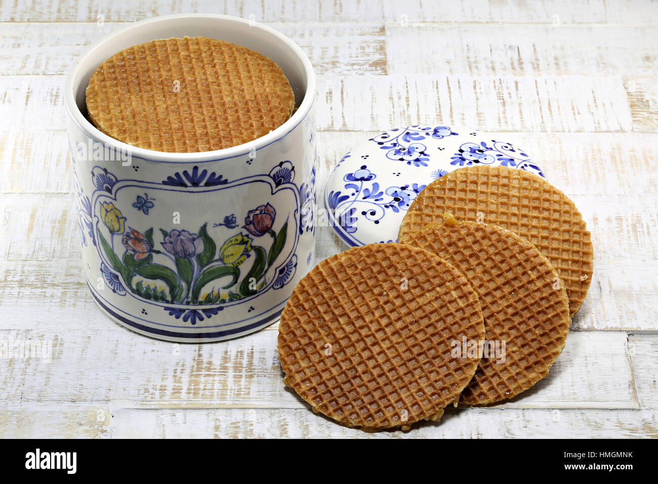 traditional Dutch syrup waffles in an original Delftware container on ...