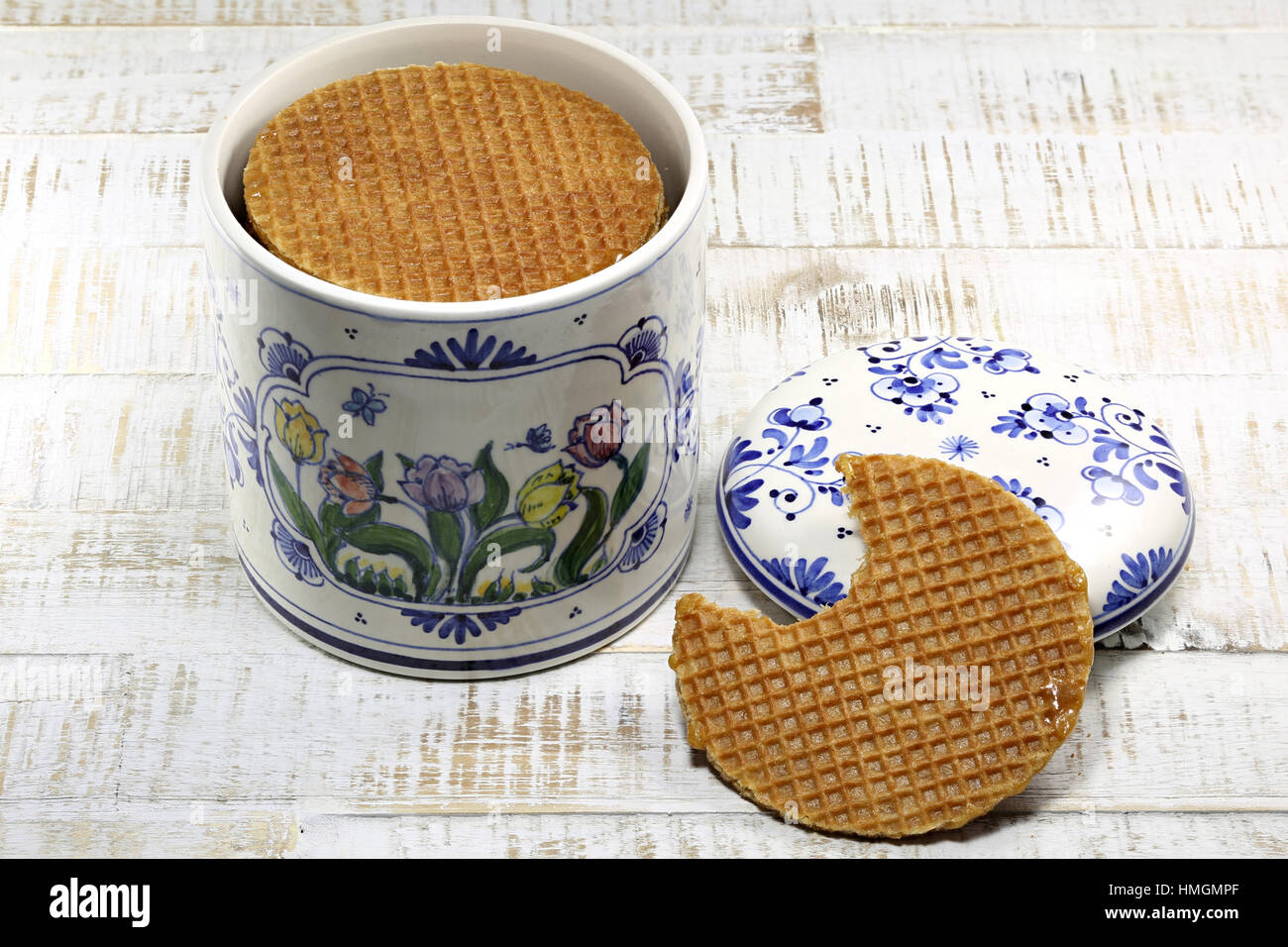 traditional Dutch syrup waffles in an original Delftware container on ...