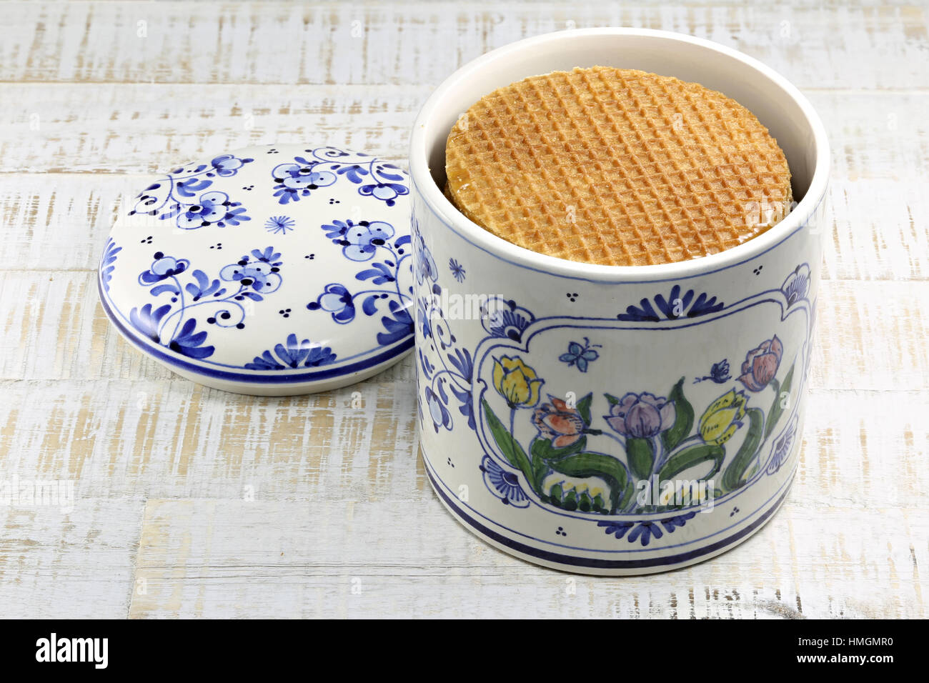 traditional Dutch syrup waffles in an original Delftware container on ...