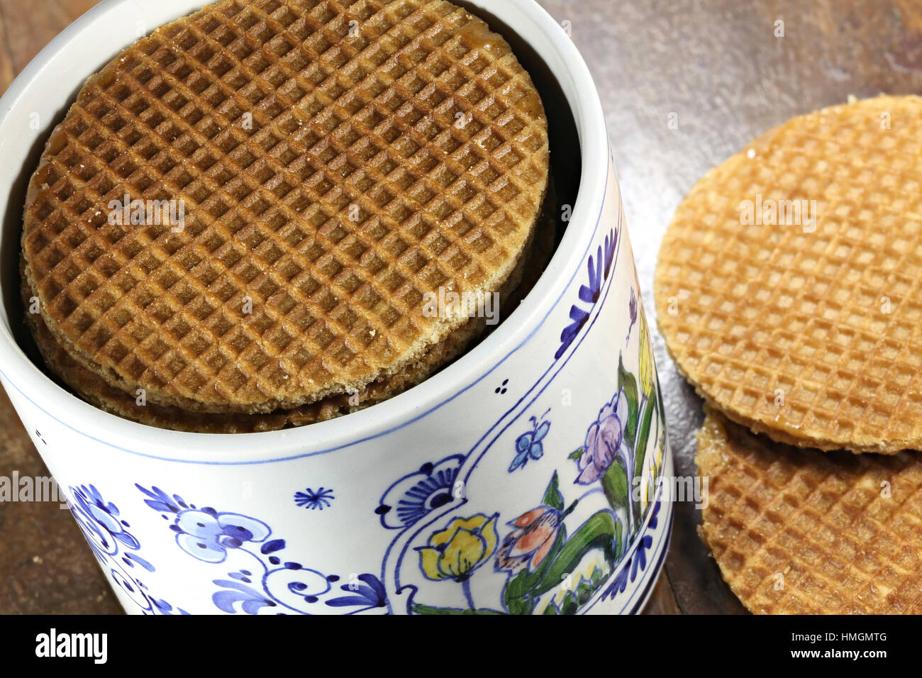 traditional Dutch syrup waffles in an original Delftware container on ...