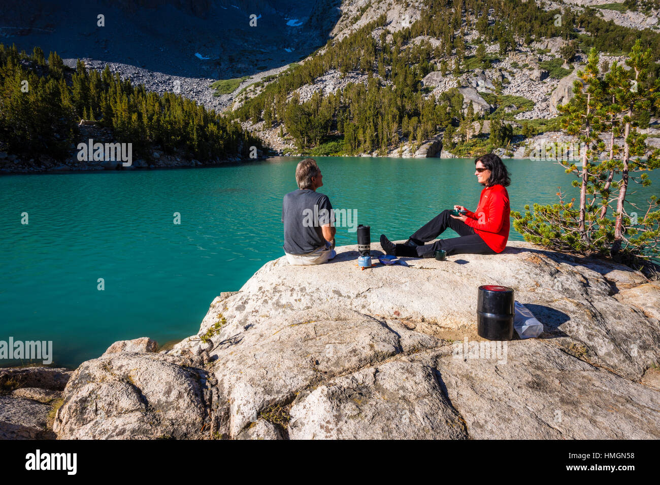 Hikers enjoying breakfast at Big Pine Lake #3, John Muir Wilderness ...