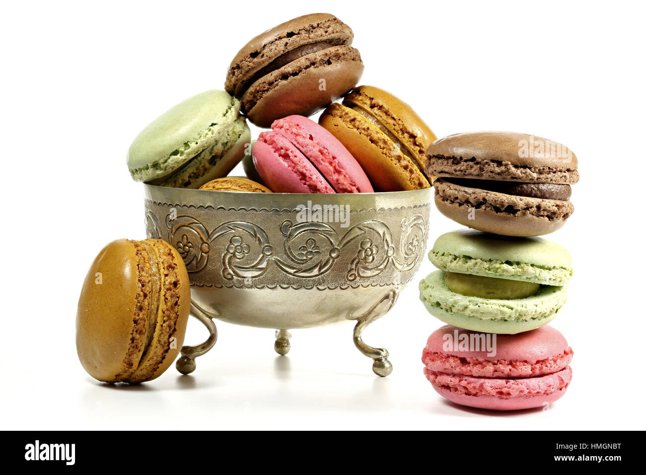 colorful macarons in a silver bowl isolated on white background Stock ...