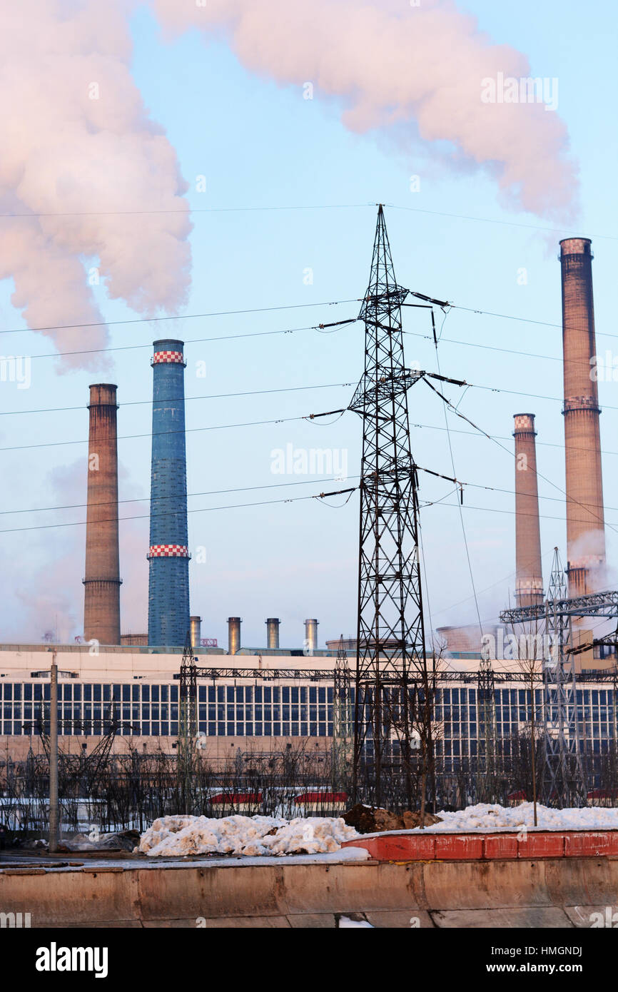 Industrial buildings polluting air with cogeneration plant blowing ...