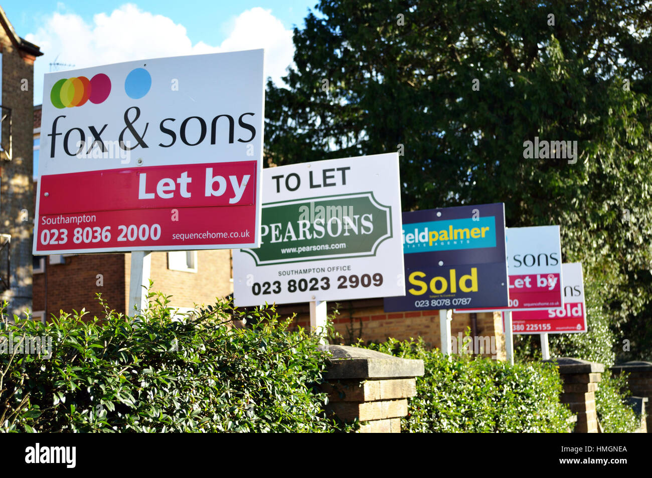 Row of estate agent signs in a residential street in Southampton ...