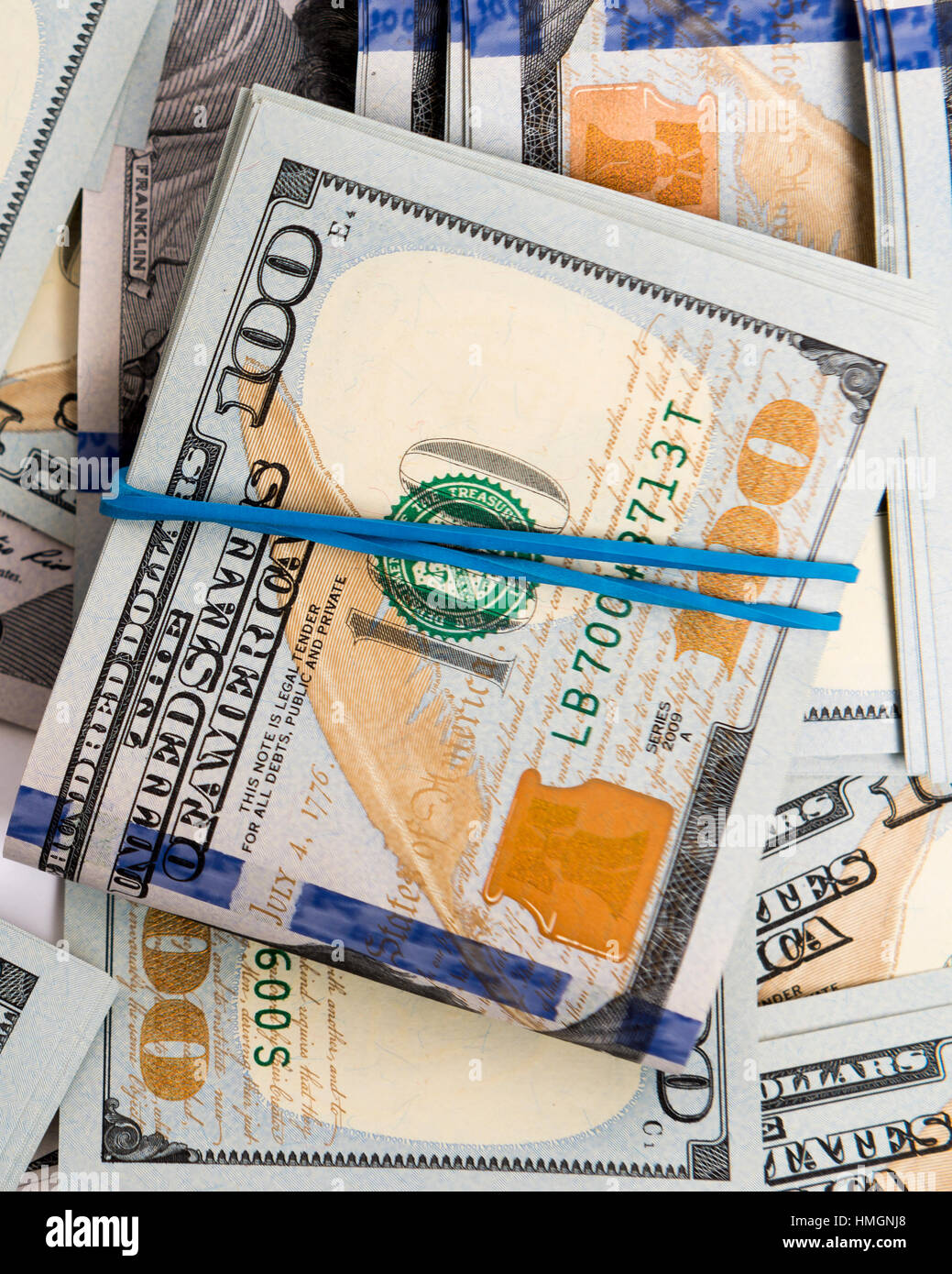 Packs of hundred dollar banknotes with rubber bands Stock Photo - Alamy