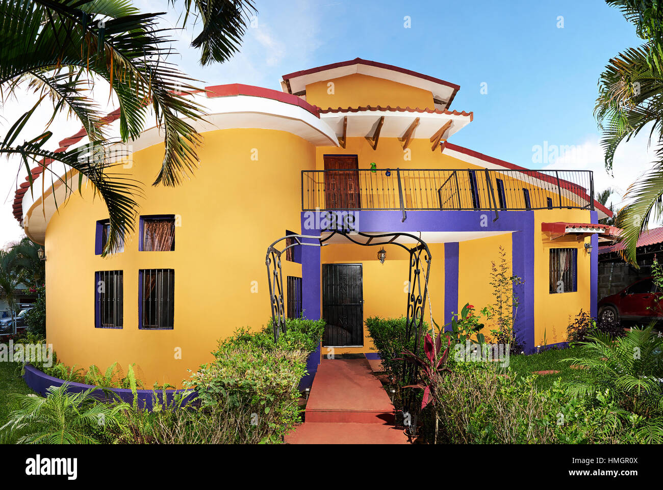 Balcony yellow paint painted home house structure hi-res stock ...