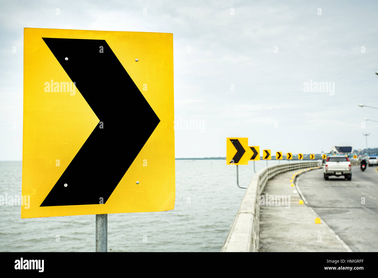 Curve road sign, signal turn right on the curve bridge Stock Photo - Alamy