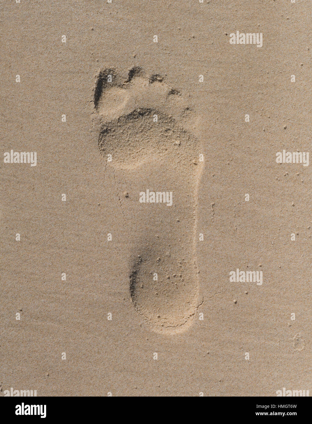 trace of human foot on the sand closeup Stock Photo - Alamy